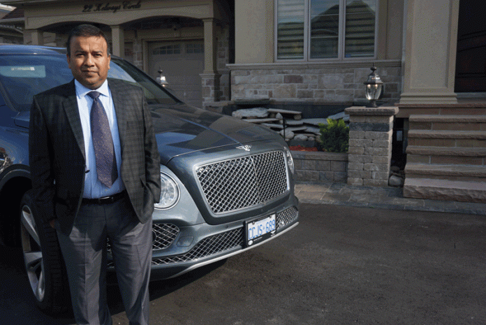 Sandeep-Gupta-in-conversation-with-his-staff-at-his-Brampton-office ...